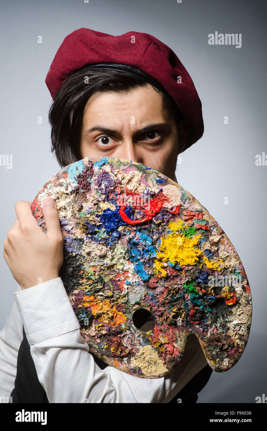 Funny artist in dark studio Stock Photo - Alamy