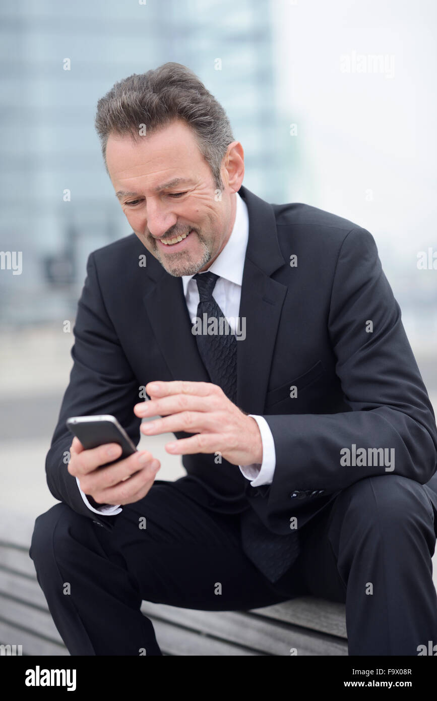 Businessman using smartphone Stock Photo - Alamy