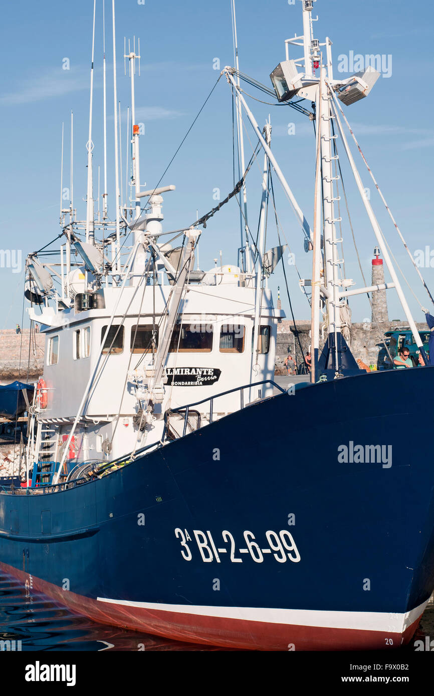 Vertical portrait of a commercial tuna fishing vessels in port ...