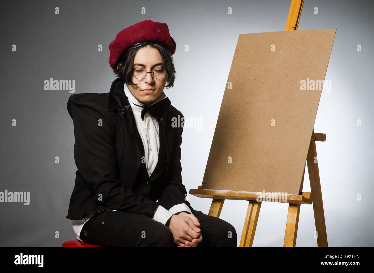 Funny artist in dark studio Stock Photo - Alamy