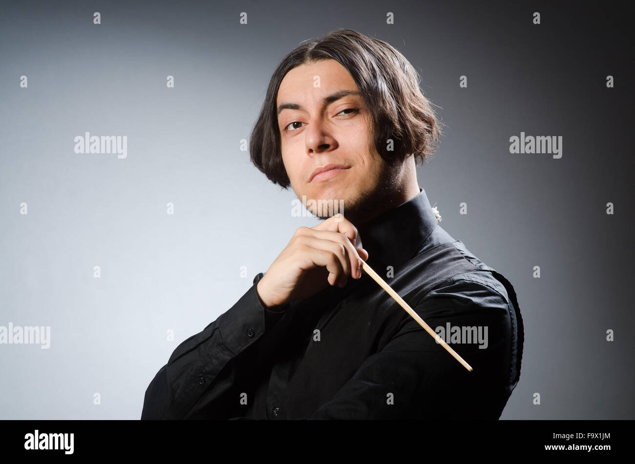 Funny conductor in musical concept Stock Photo - Alamy