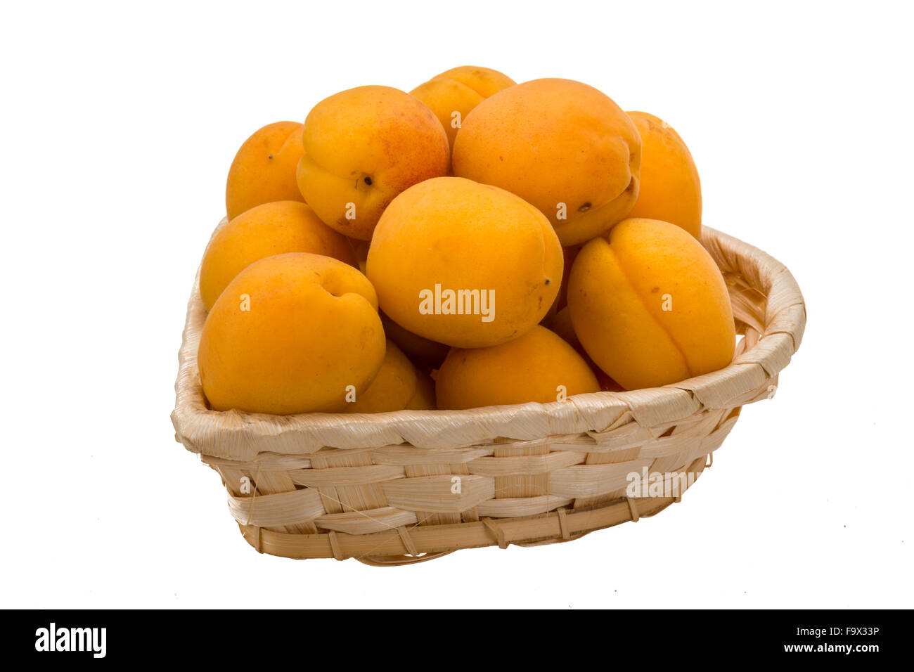 Yellow bright apricots isolated on white Stock Photo - Alamy