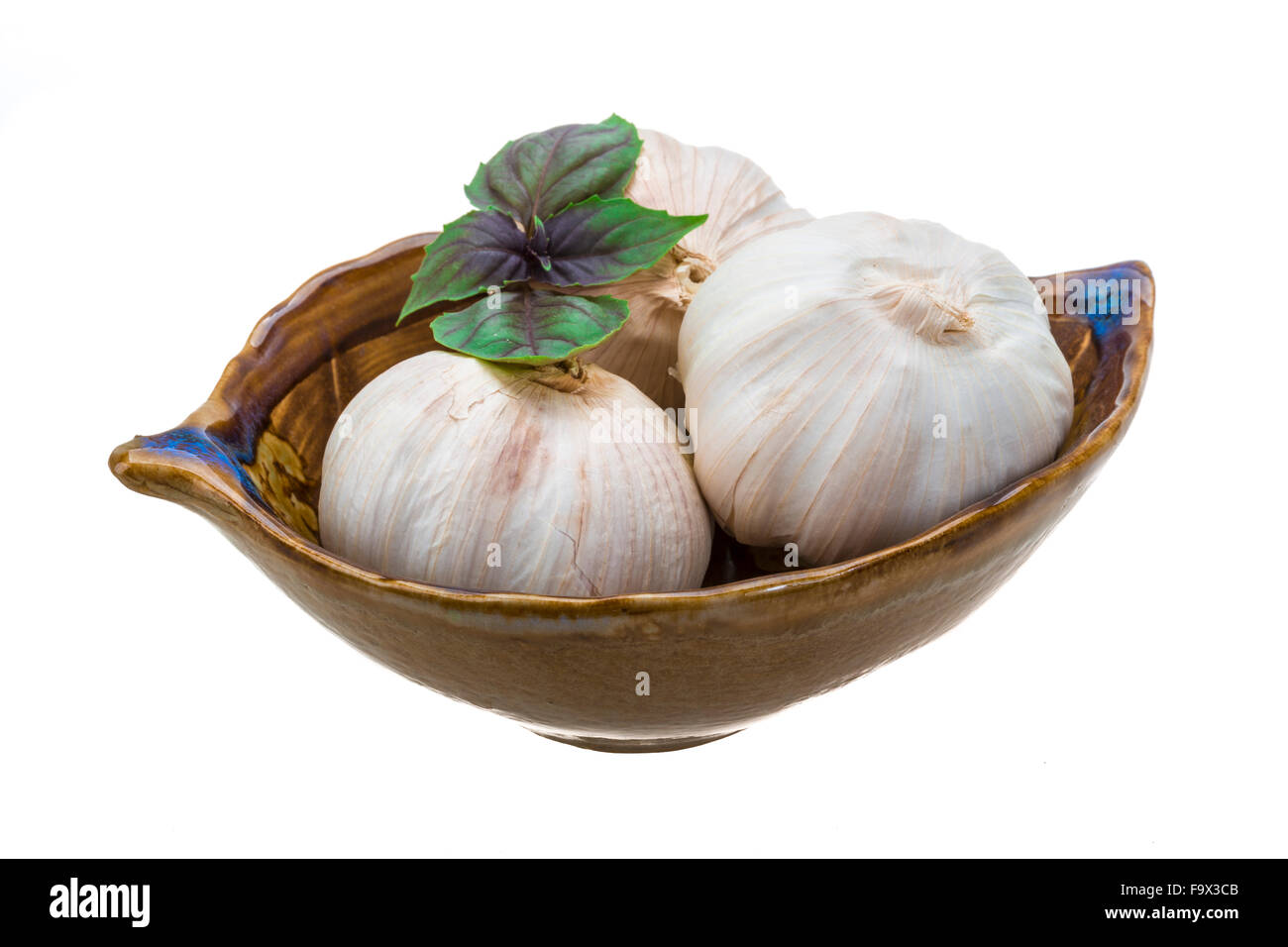 Ripe garlic with basil leaf Stock Photo - Alamy