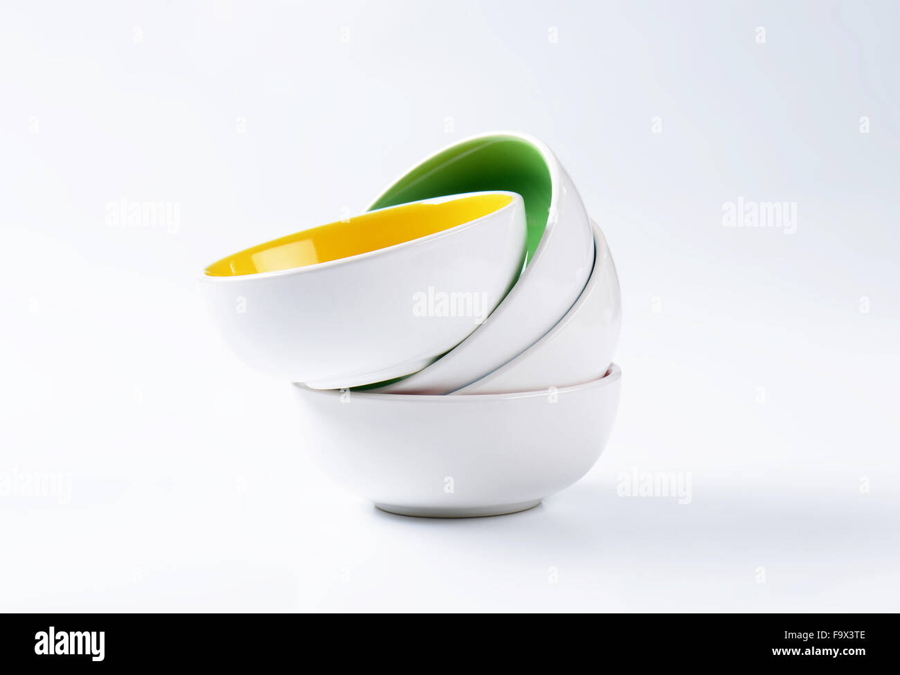 Stack of round two tone bowls Stock Photo - Alamy