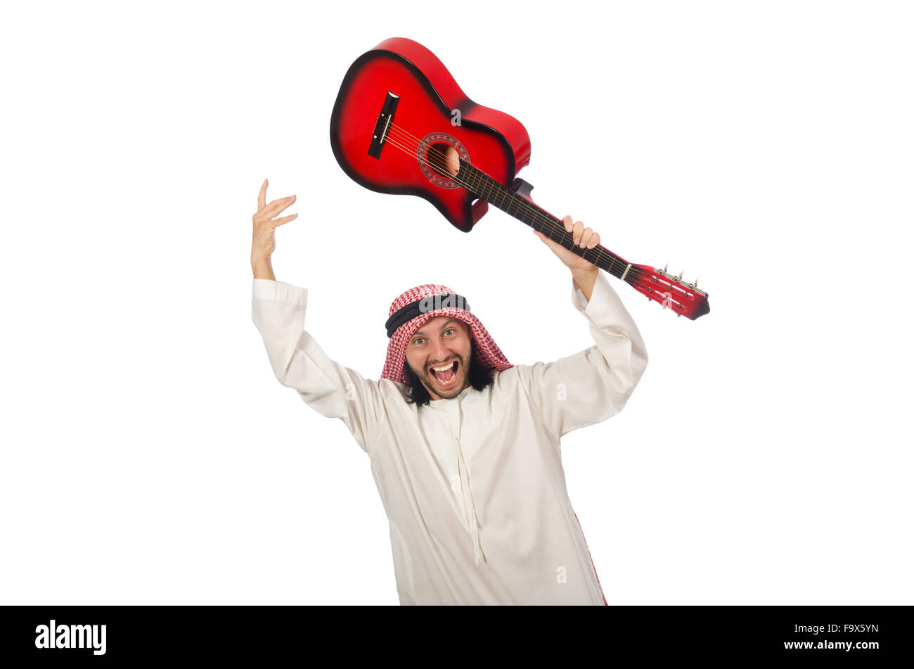 Arab man playing isolated on white Stock Photo - Alamy