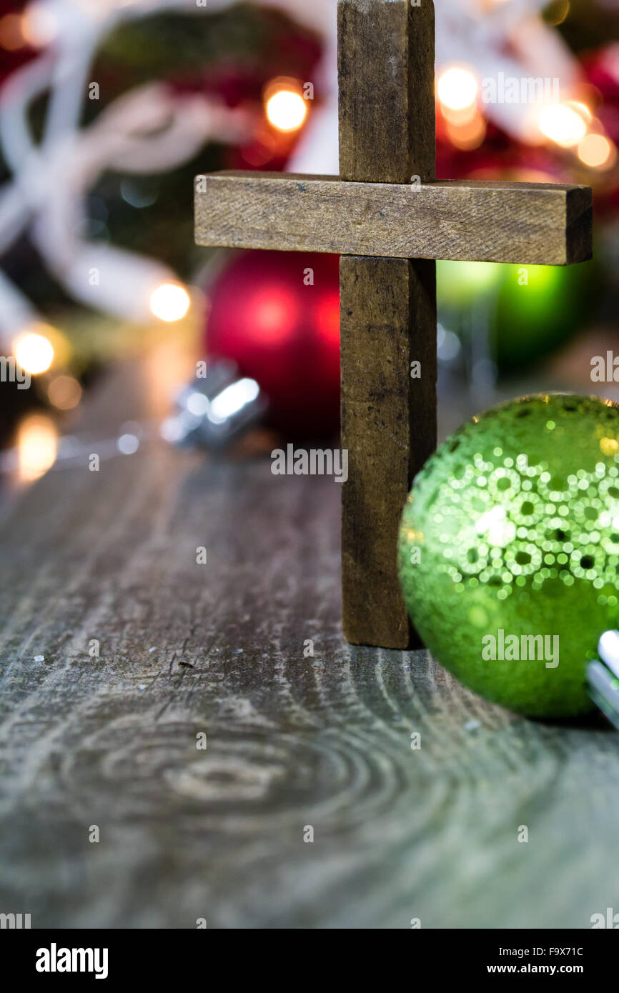 A wooden christmas cross with Christmas decorations Stock Photo - Alamy