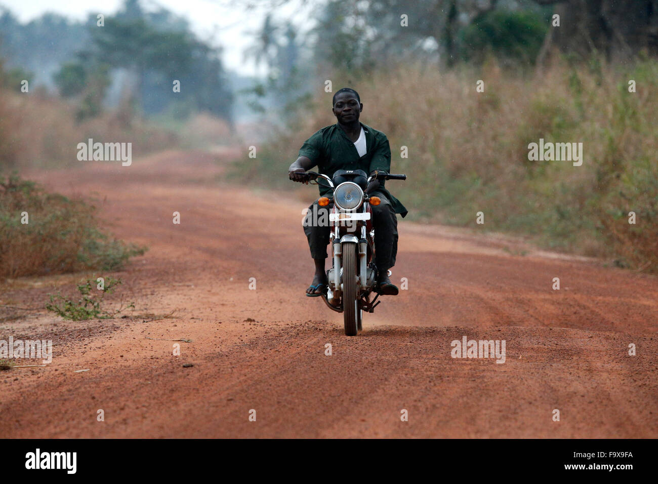Motorbike on a track in Togo Stock Photo - Alamy