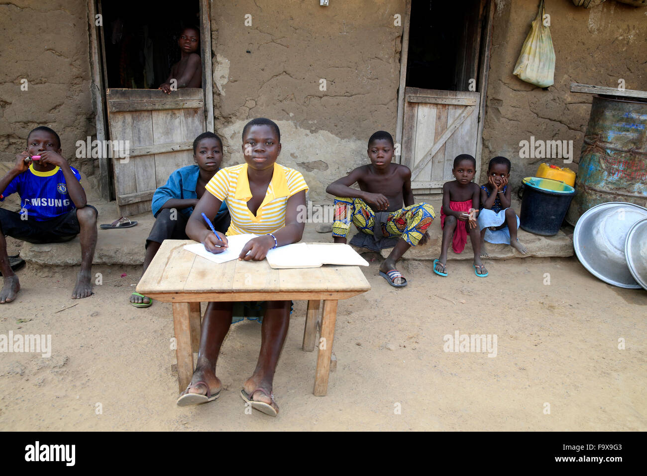 Everyday life in an African village. Homework Stock Photo - Alamy