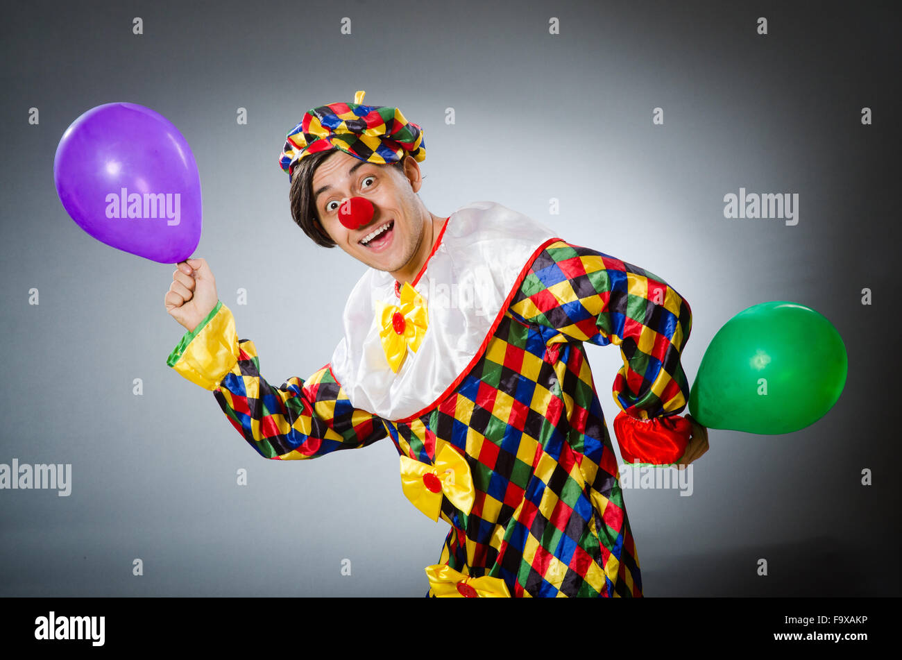 Funny clown in comical concept Stock Photo - Alamy