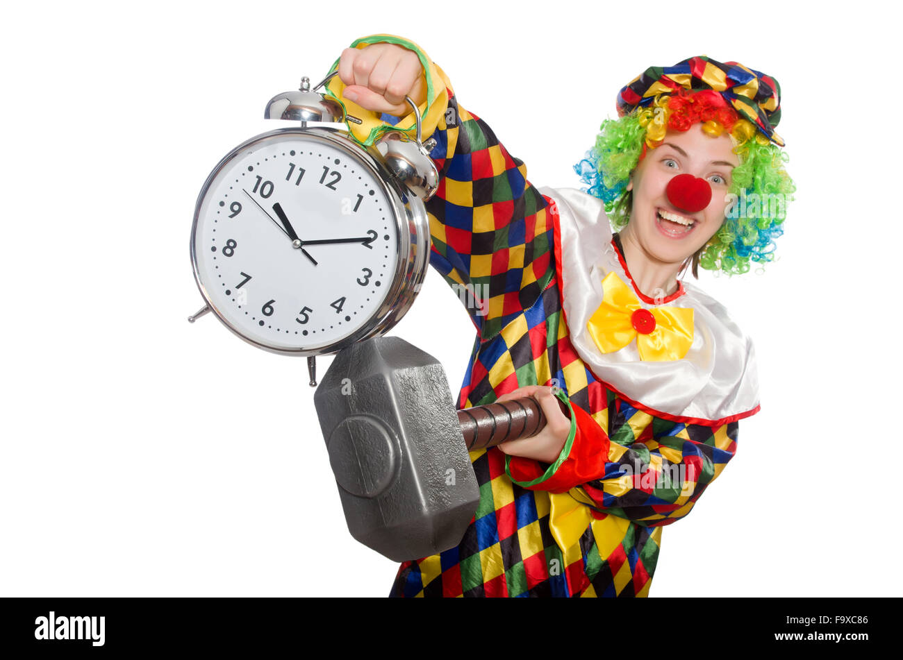 Clown with clock and hammer isolated on white Stock Photo - Alamy