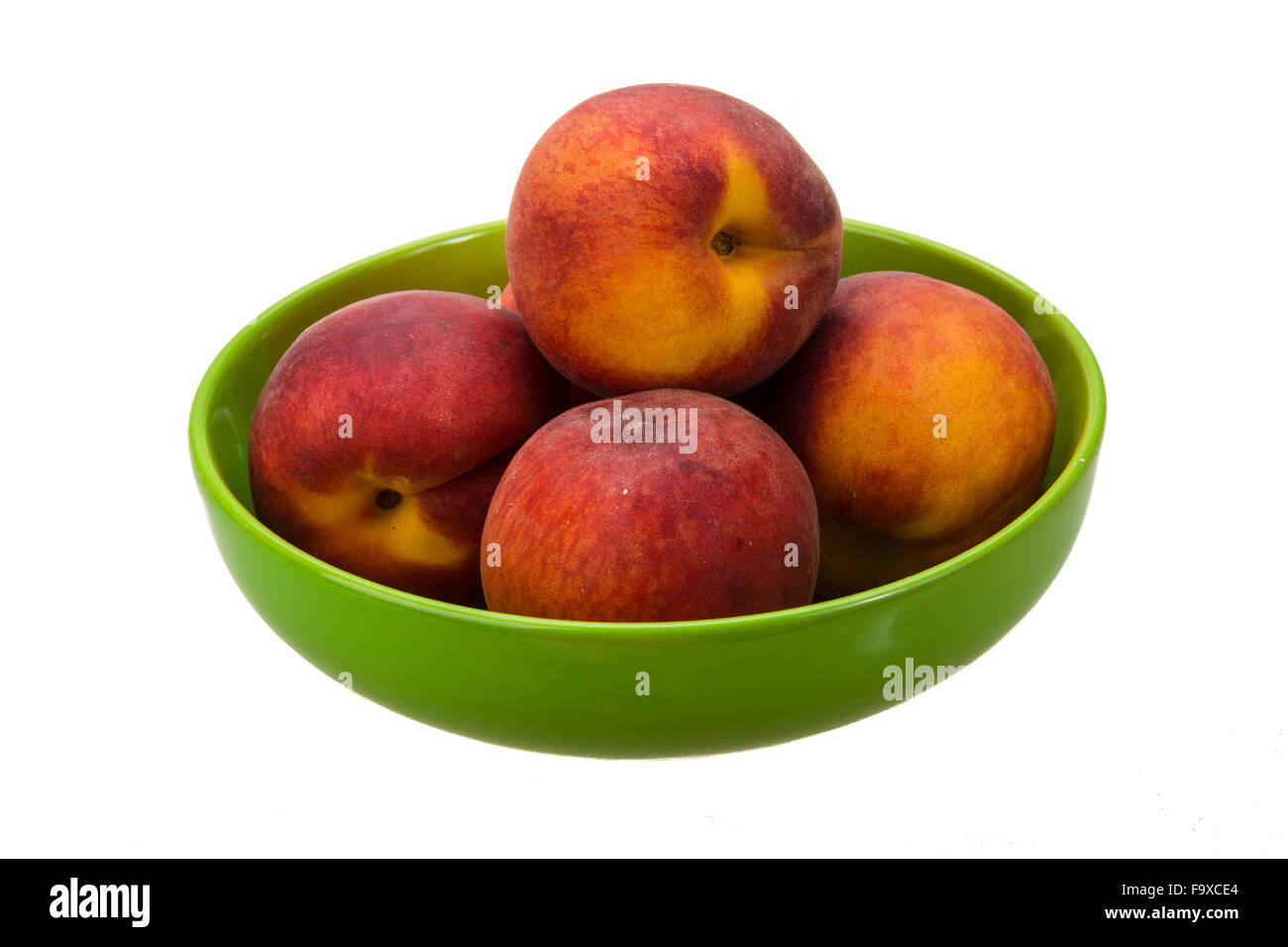 Ripe bright peaches isolated on white in the bowl Stock Photo - Alamy