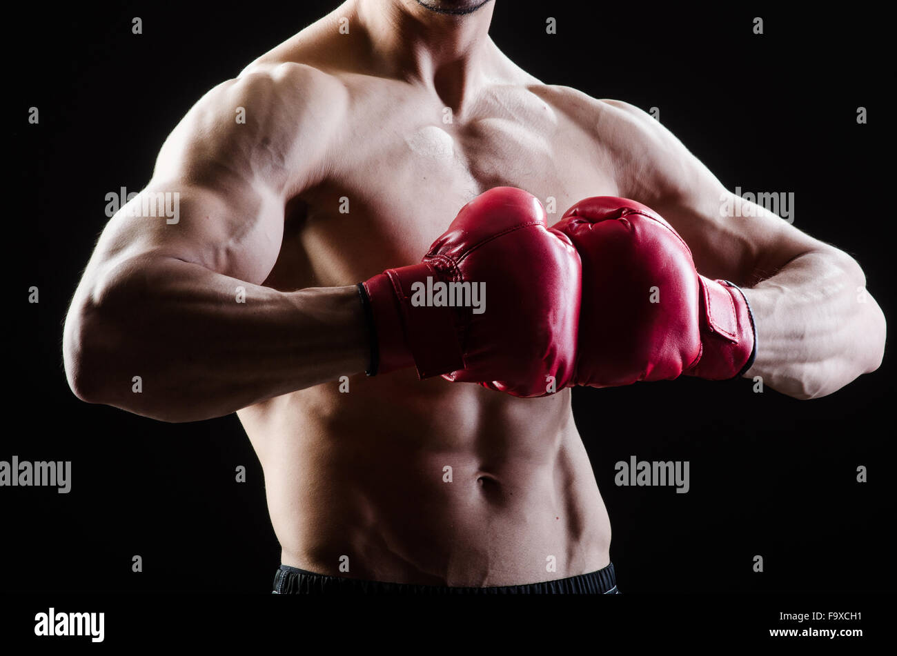 Muscular man in boxing concept Stock Photo - Alamy