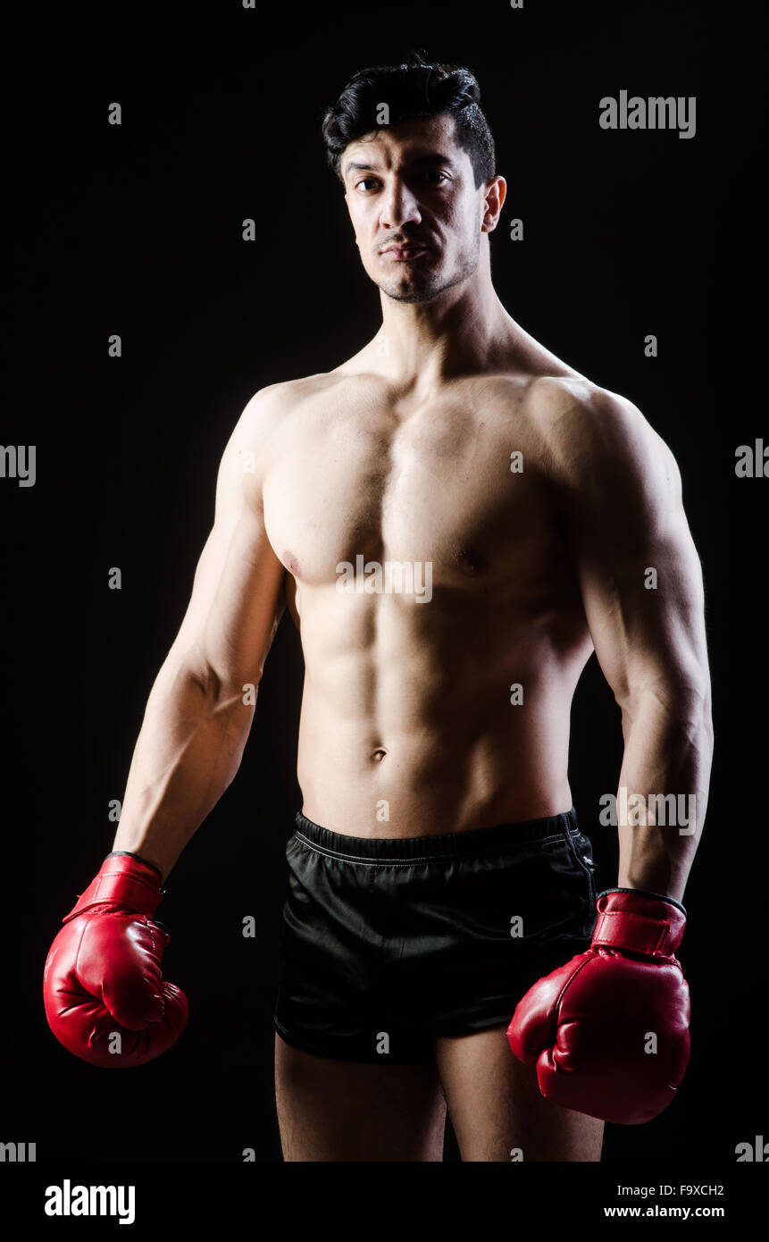 Muscular man in boxing concept Stock Photo - Alamy
