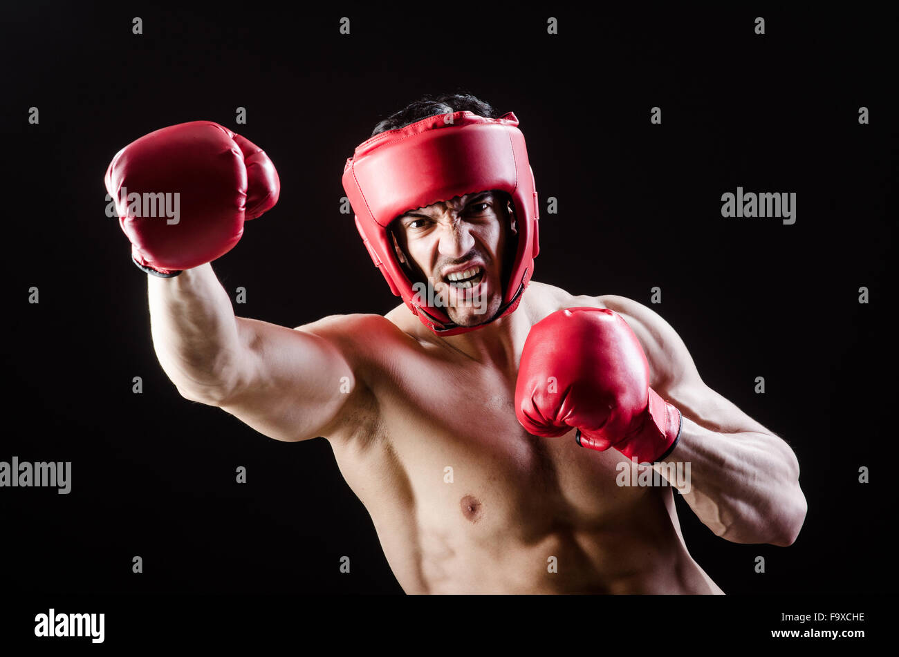 Muscular man in boxing concept Stock Photo - Alamy