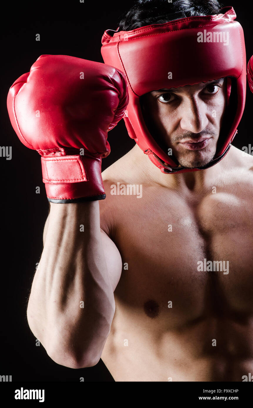 Muscular man in boxing concept Stock Photo - Alamy