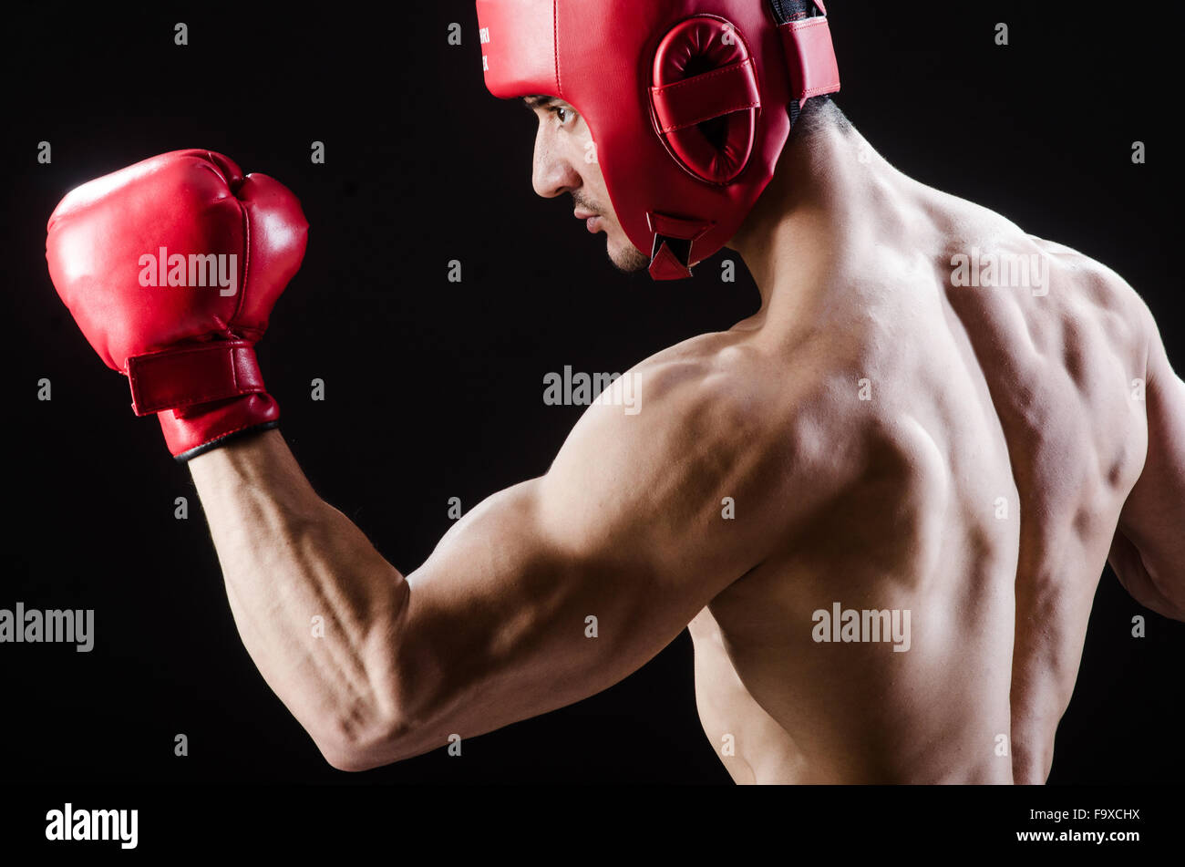 Muscular man in boxing concept Stock Photo - Alamy