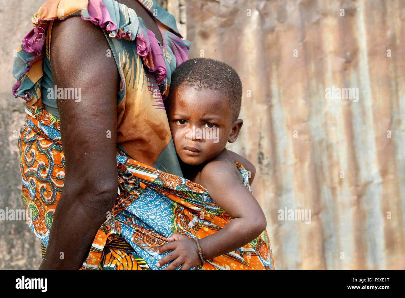 African baby carried on the back of his mother Stock Photo - Alamy