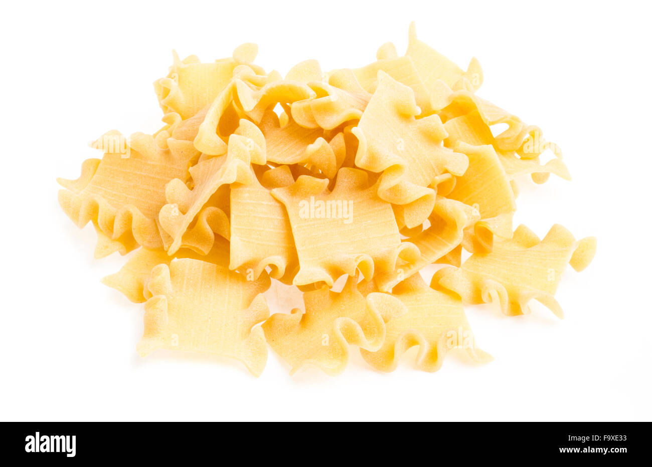 Raw yellow Italian pasta Stock Photo - Alamy