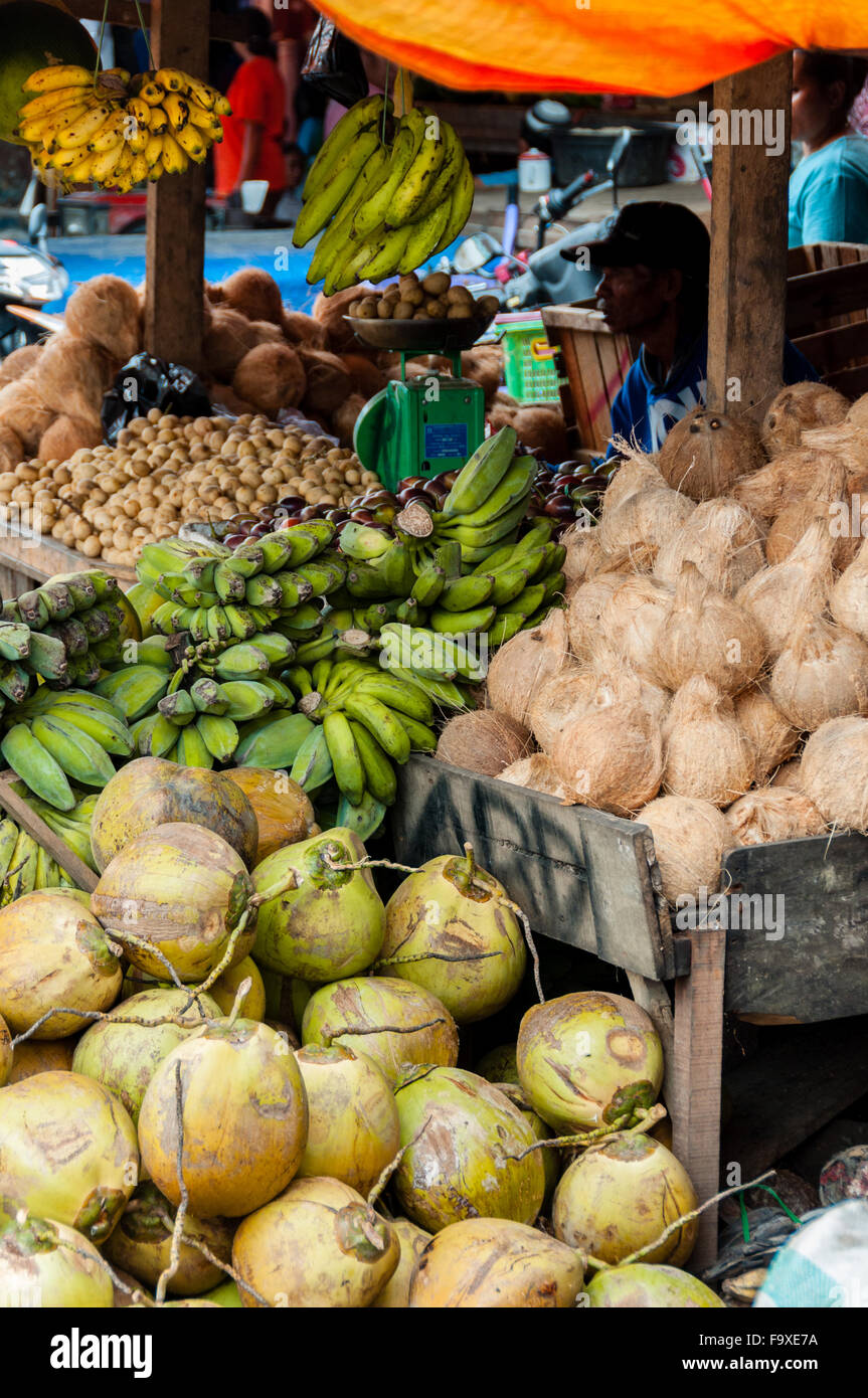 Vendor Selling Coconuts and Green Bananas at local market in Indonesia ...