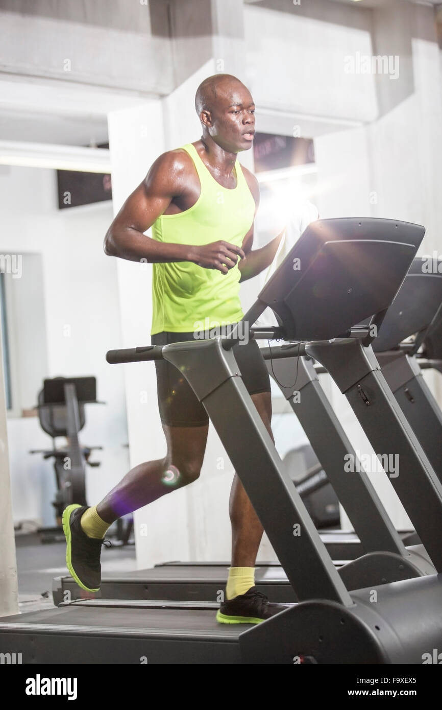 Athlete running on treadmill in gym Stock Photo - Alamy
