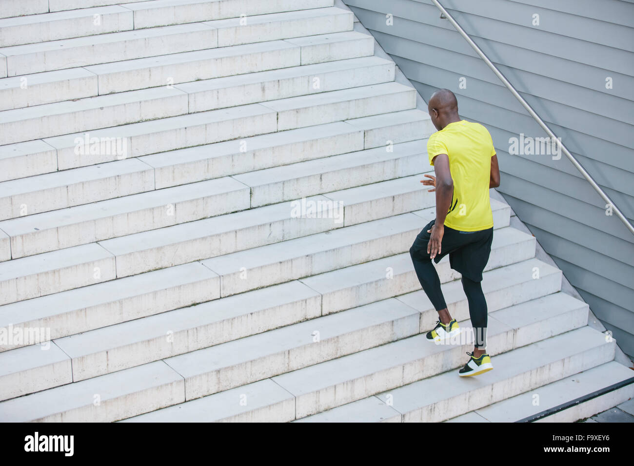 Athlete running up stairs Stock Photo - Alamy