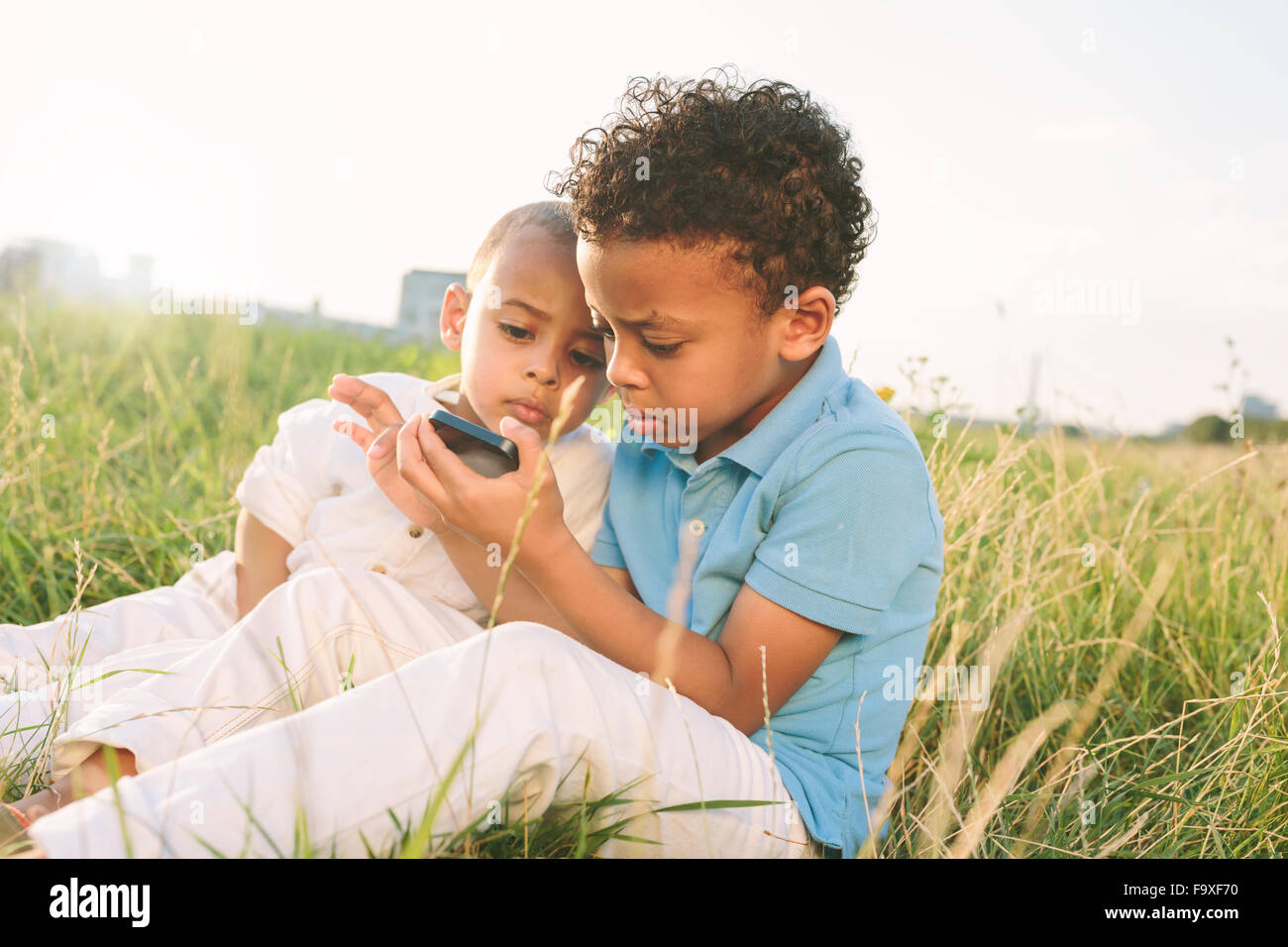Two boys in field hi-res stock photography and images - Alamy