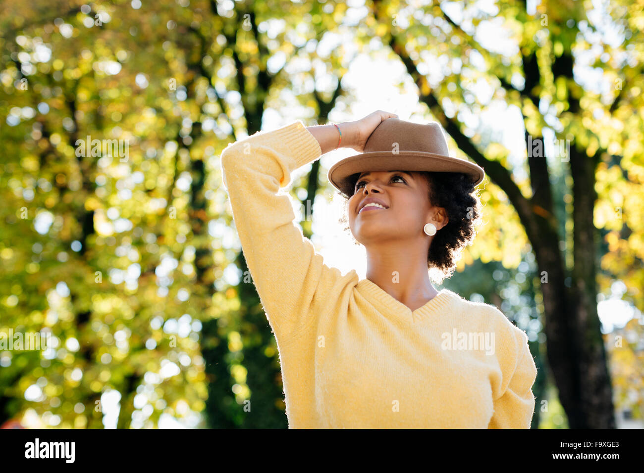 Beautiful black woman wearing hat outdoor in autumn Stock Photo - Alamy