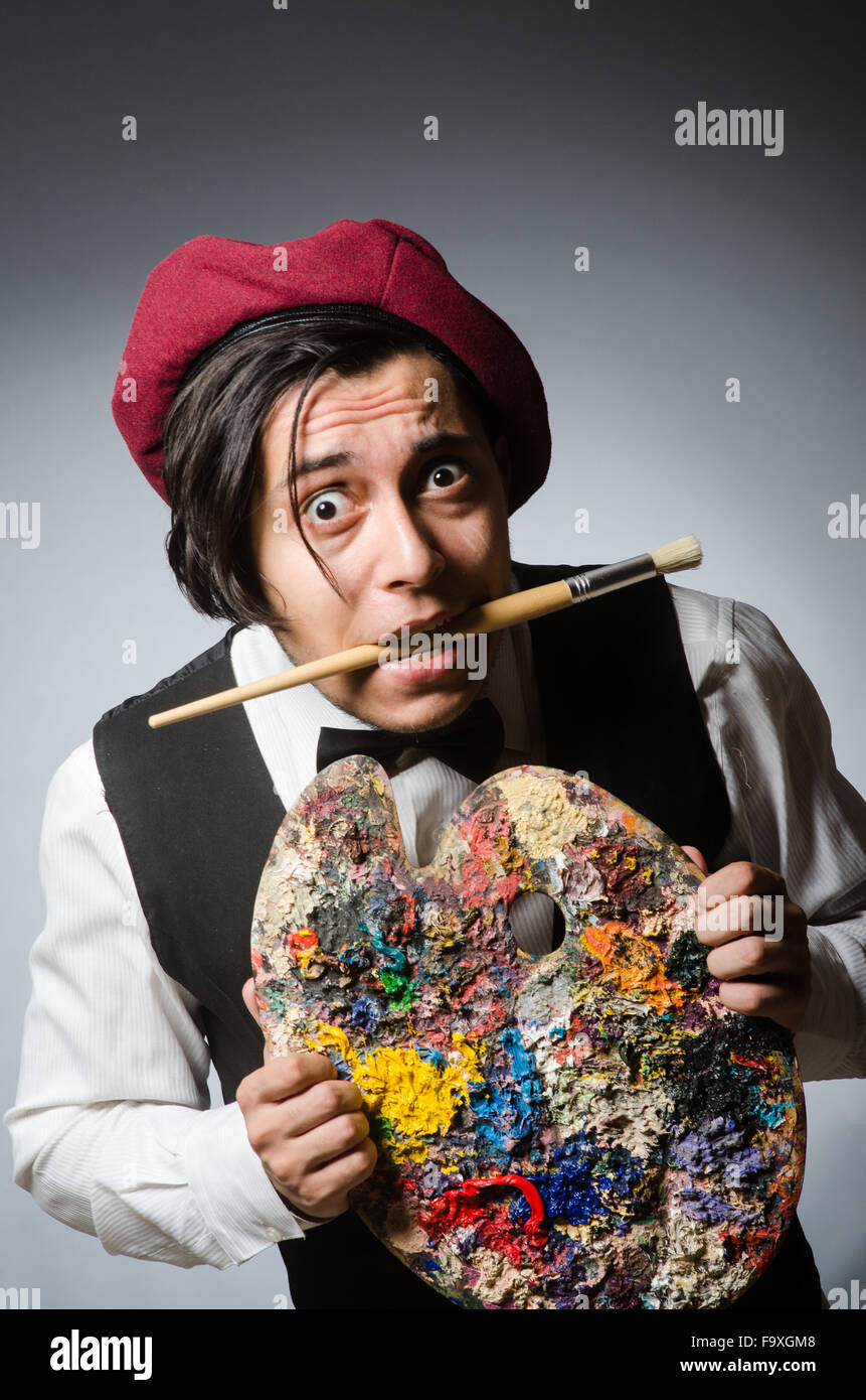 Funny artist in dark studio Stock Photo - Alamy