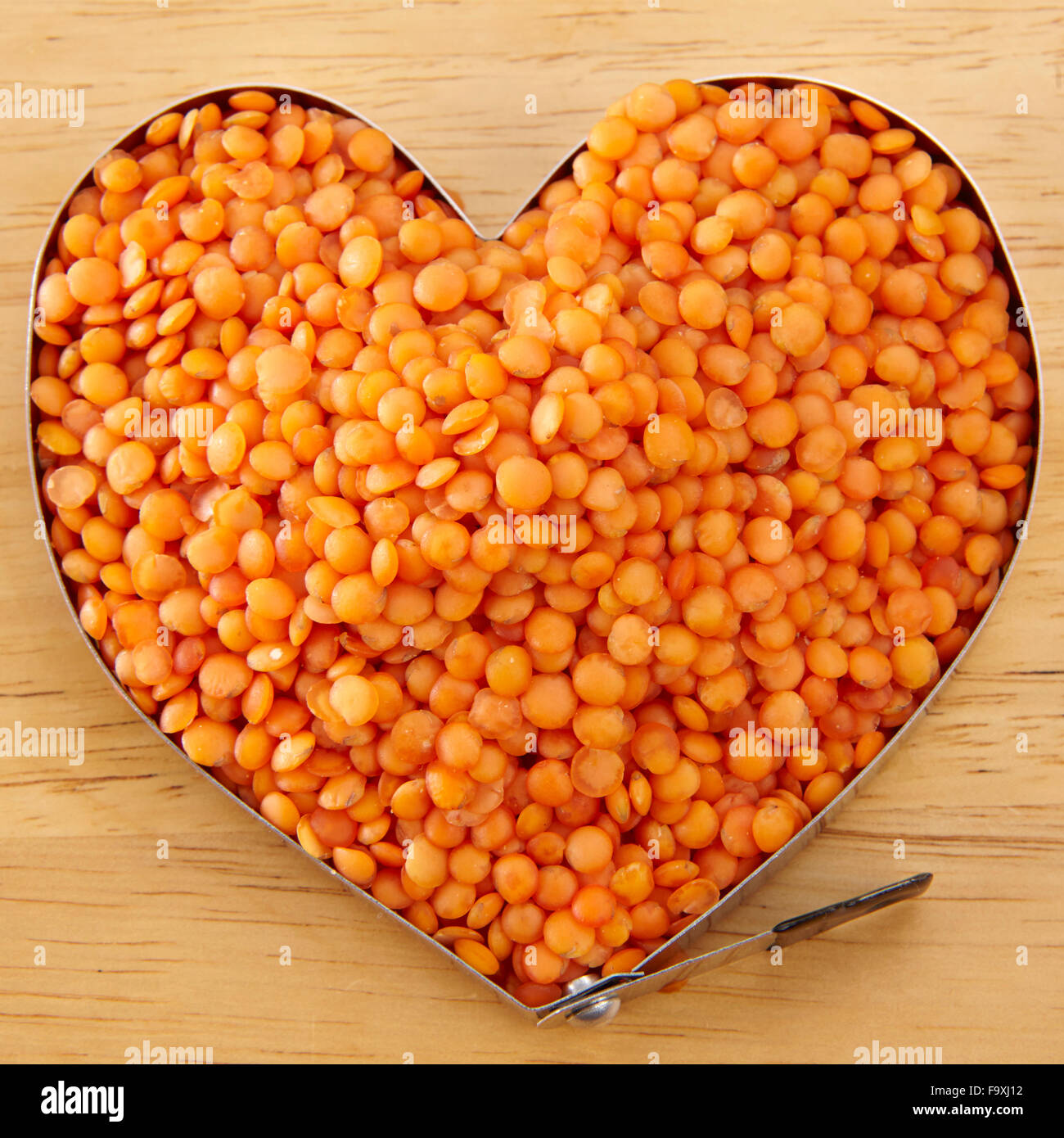red rentils in the heart shape container Stock Photo - Alamy