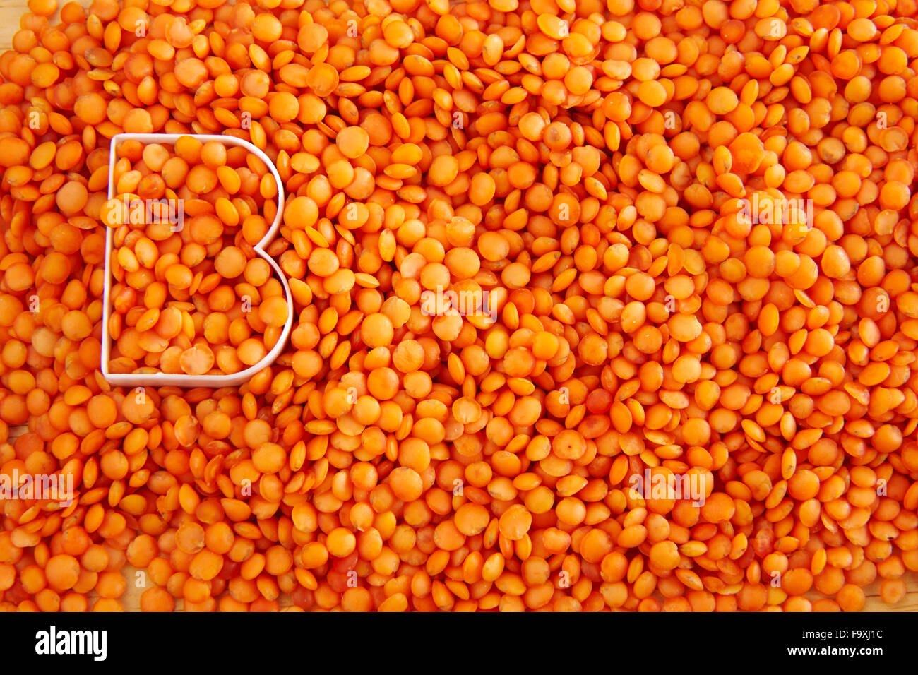 word B and red rentils Stock Photo - Alamy