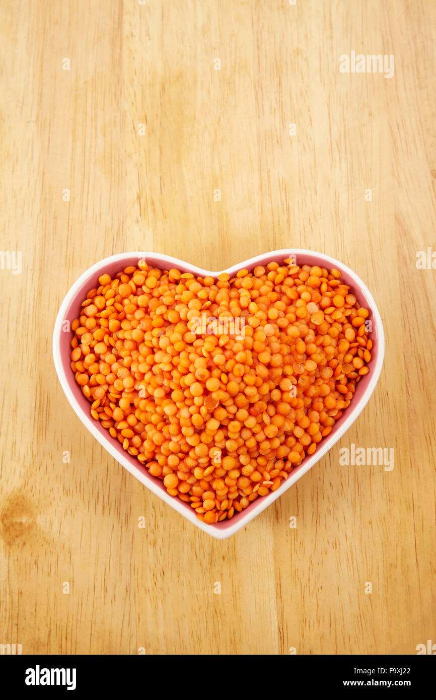 red rentils in the heart shape container Stock Photo - Alamy