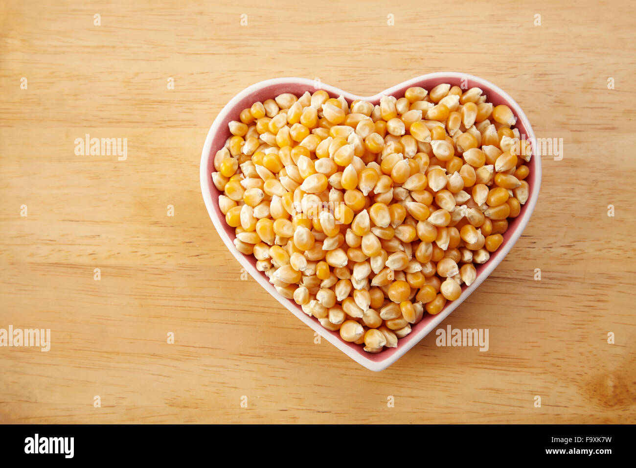 yellow daal in the heart shape container Stock Photo - Alamy