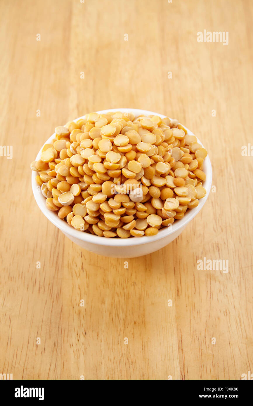 yellow daal on the wooden bckground Stock Photo - Alamy