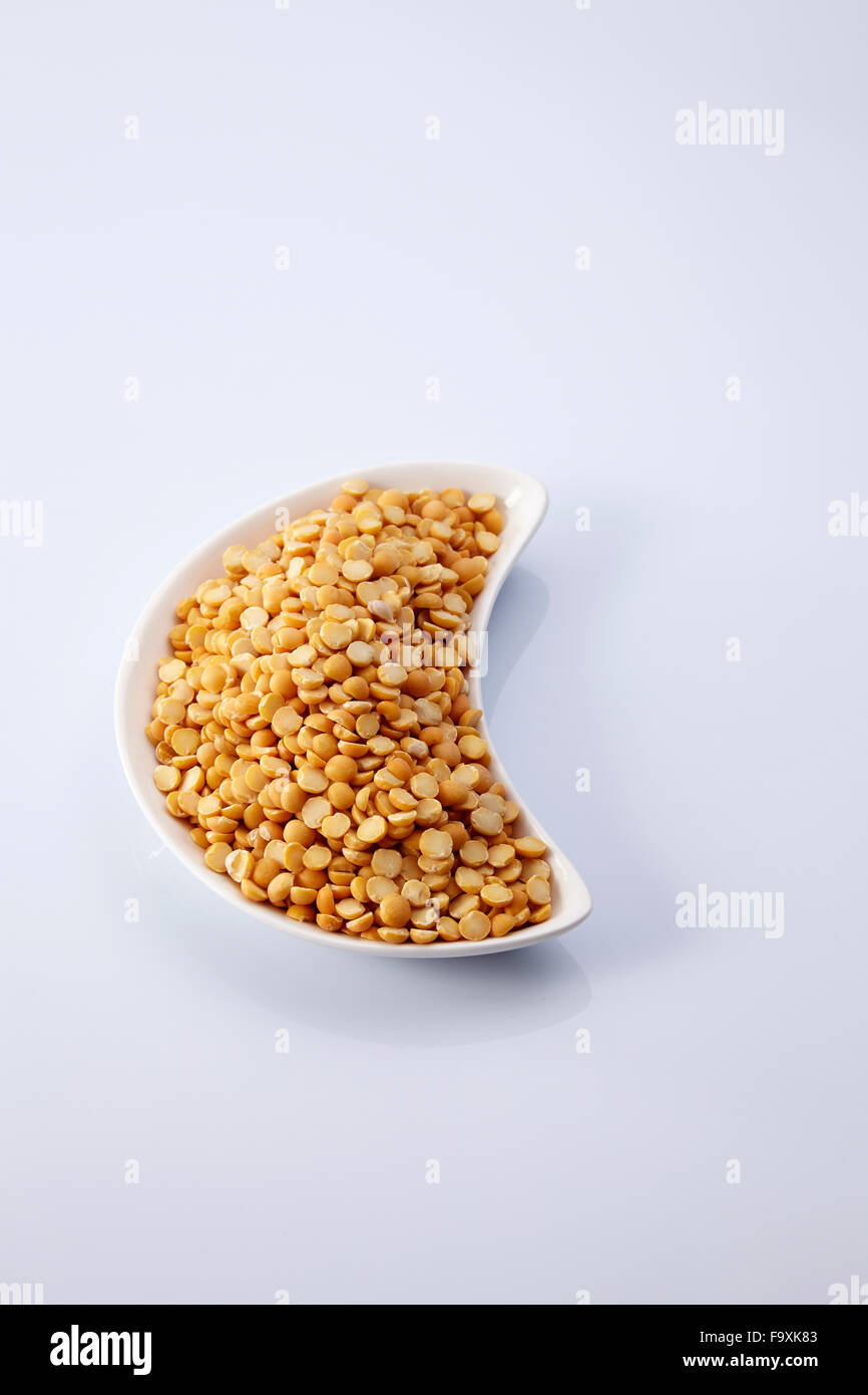yellow daal on the white background Stock Photo - Alamy