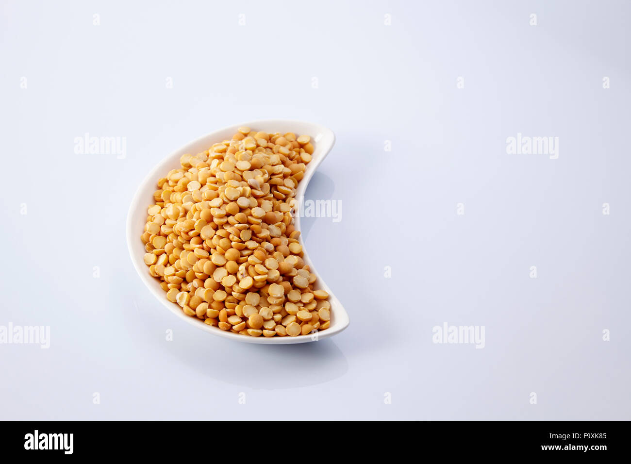 yellow daal on the white background Stock Photo - Alamy