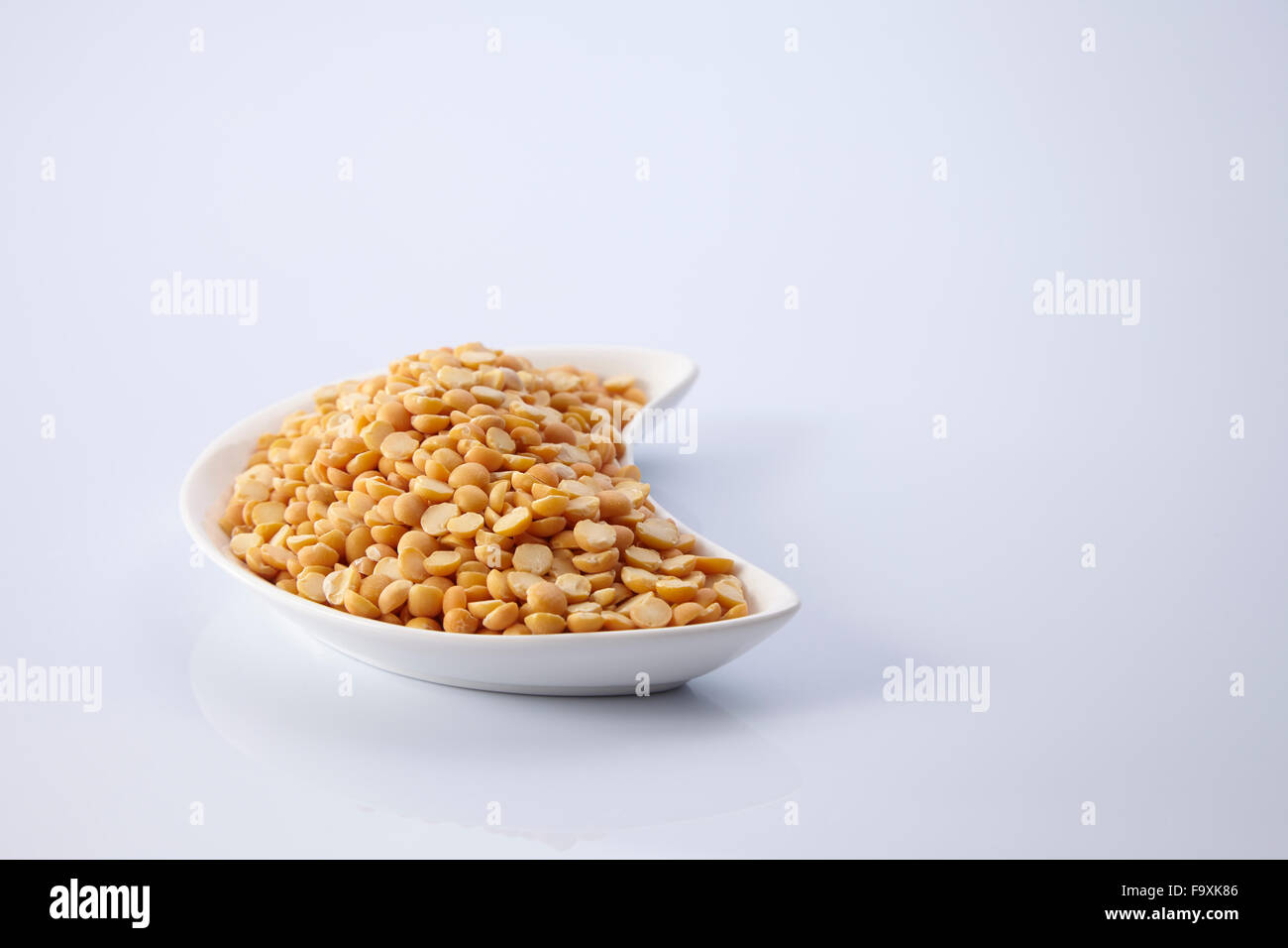 yellow daal on the white background Stock Photo - Alamy