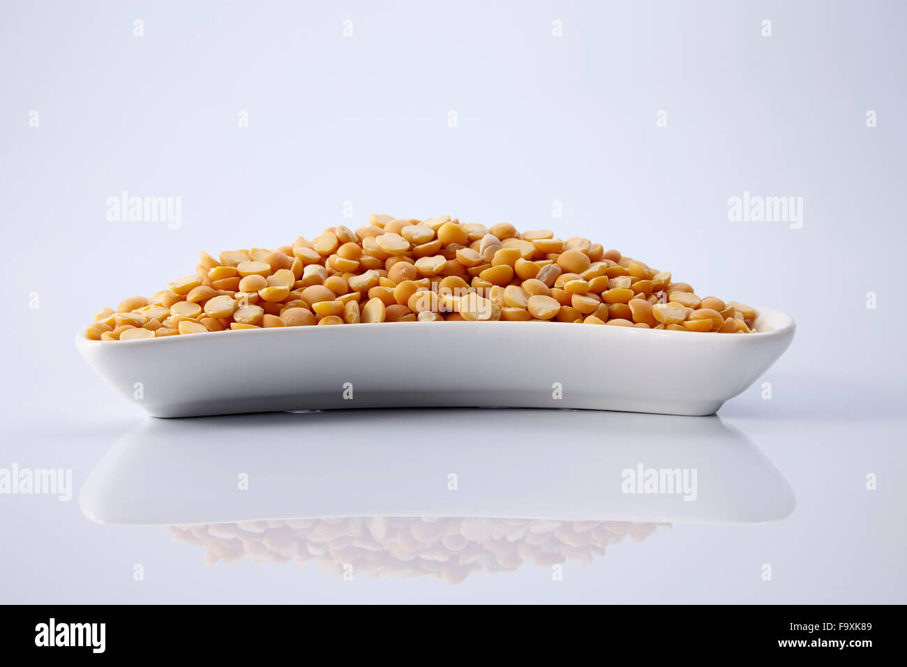 yellow daal on the white background Stock Photo - Alamy