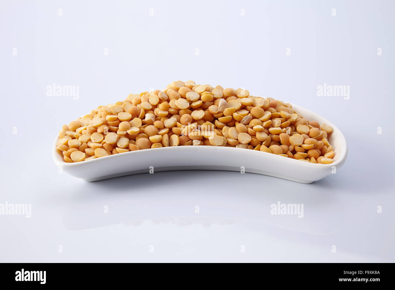 yellow daal on the white background Stock Photo - Alamy
