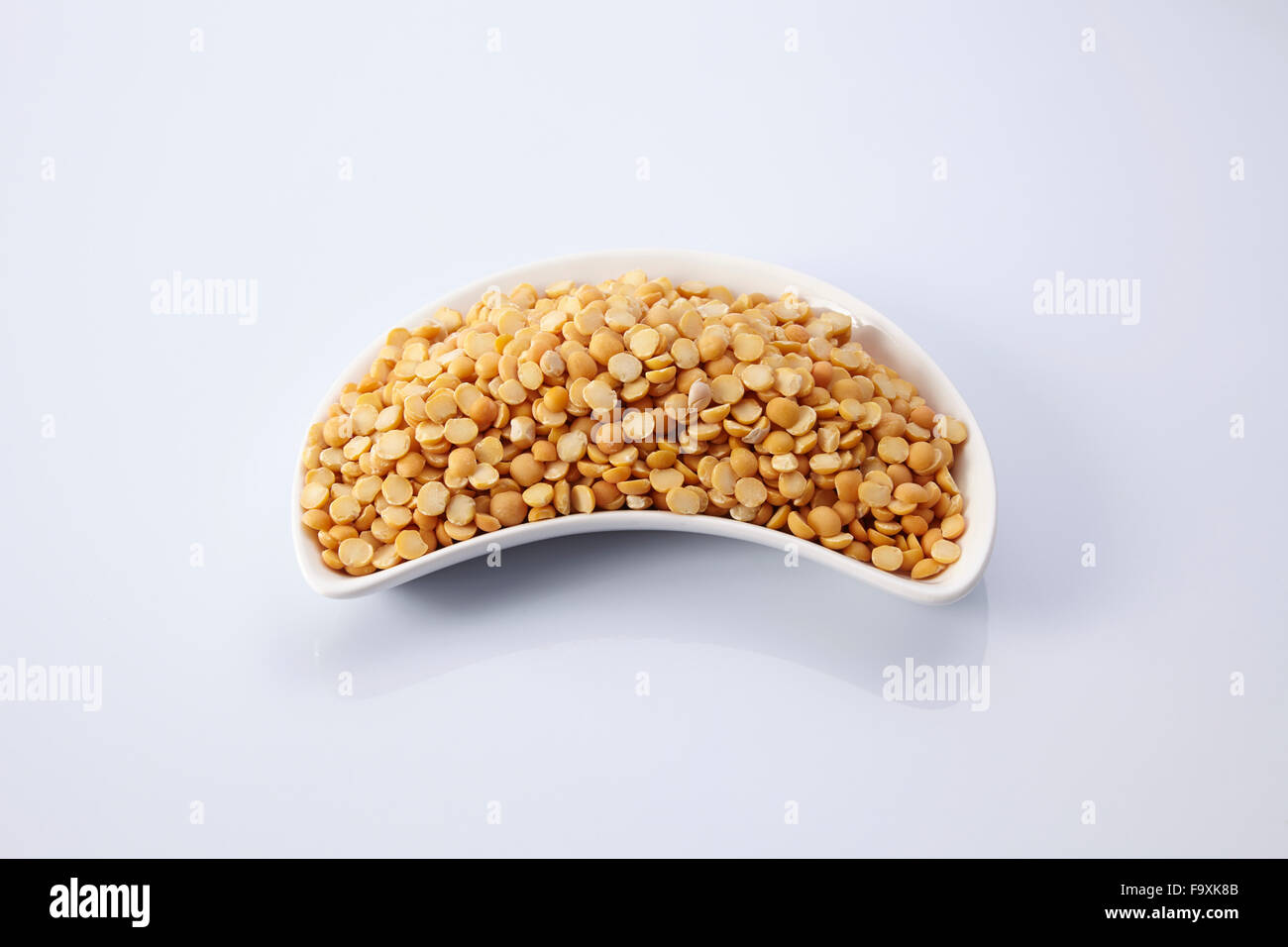 yellow daal on the white background Stock Photo - Alamy