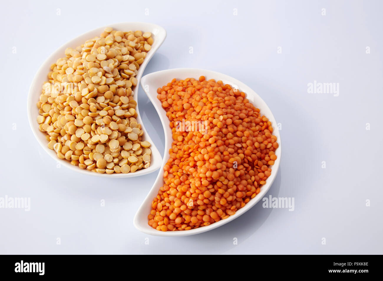 red and yellow daal on the white background Stock Photo - Alamy