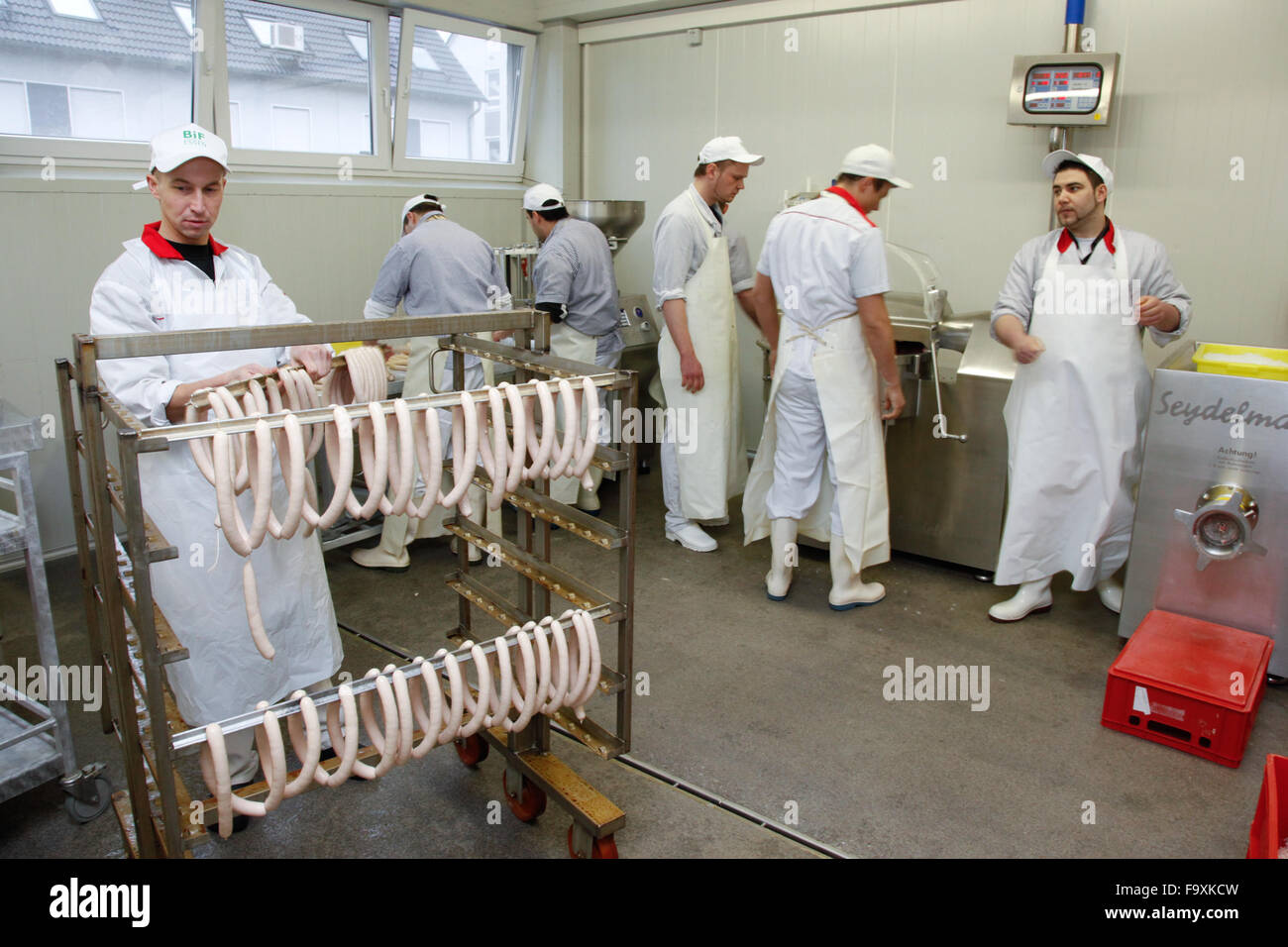 Butcher during her vocational training Stock Photo - Alamy