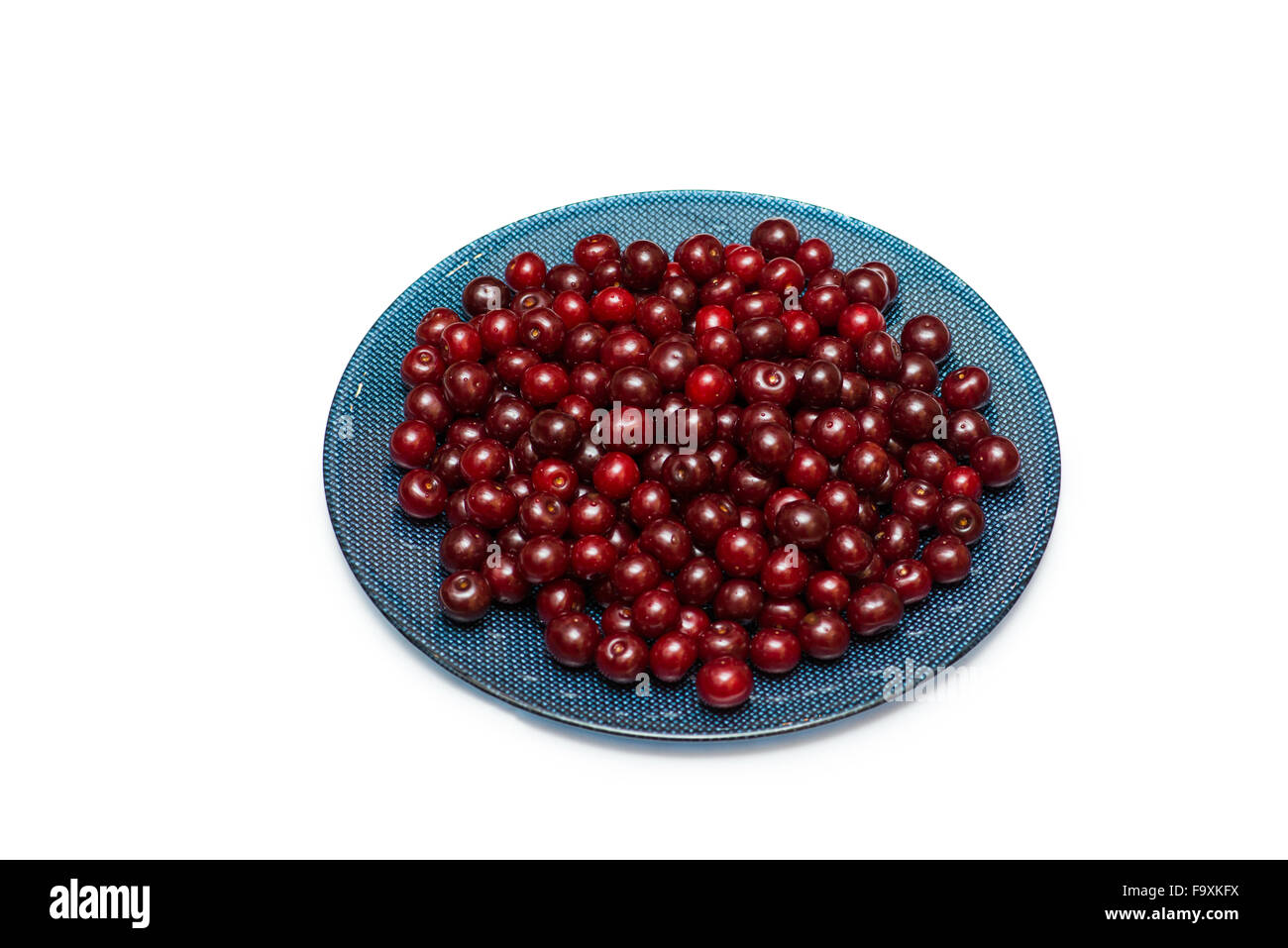 Plate full of cherries isolated on white Stock Photo - Alamy