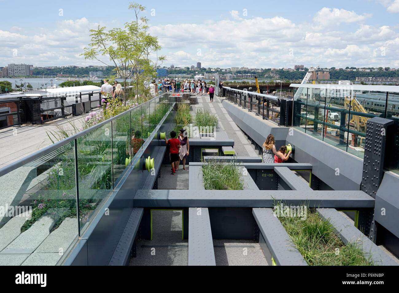Green gardens on elevated High Line Park with Hudson River in the ...