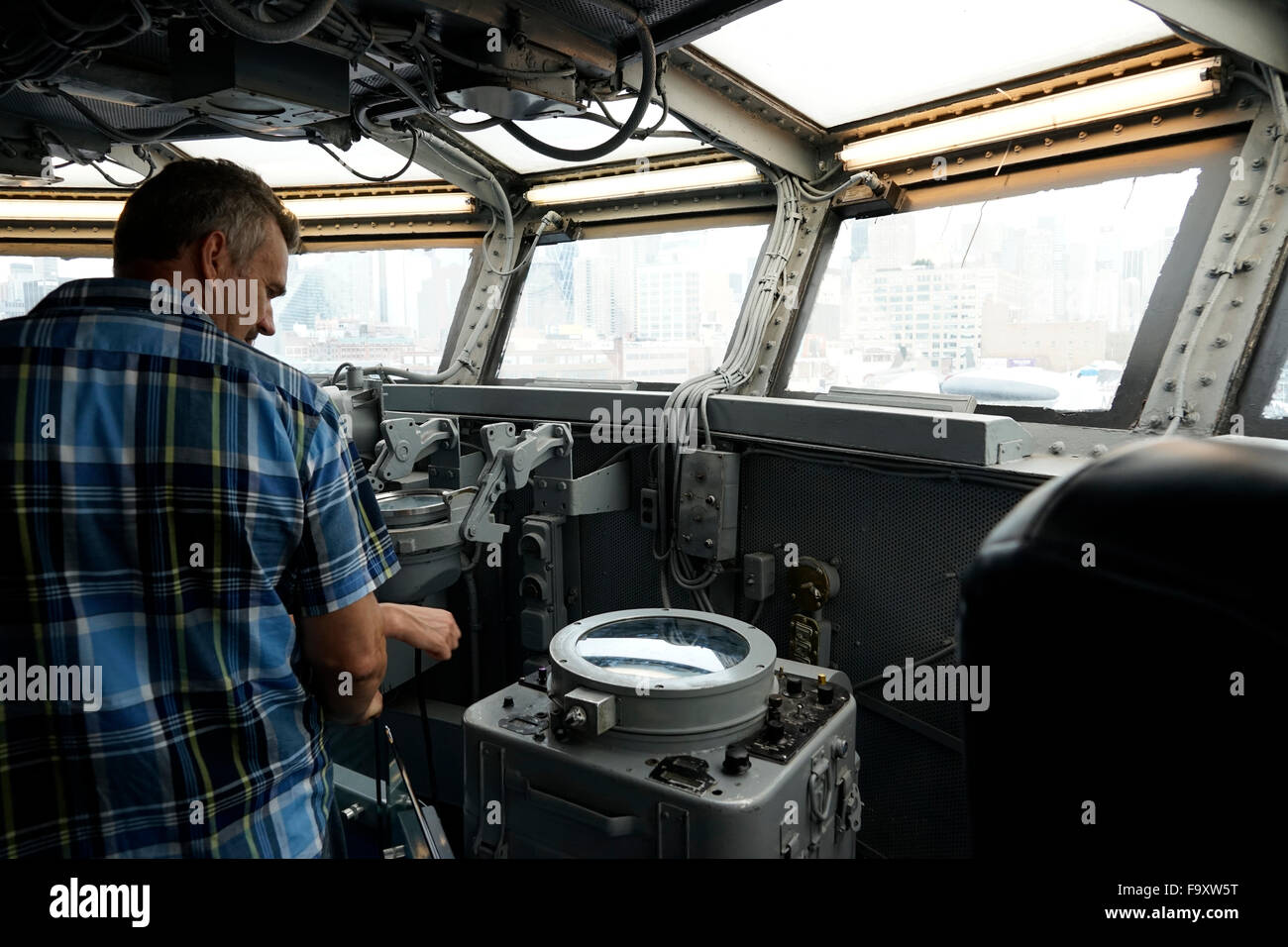 Visitors inside of the bridge of Intrepid aircraft carrier. the ...