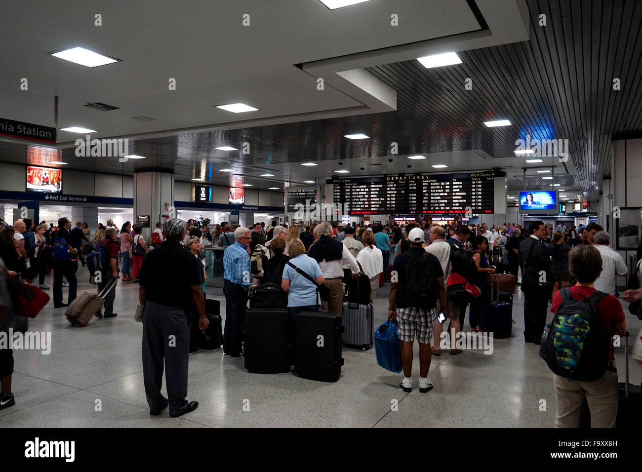 Commuters waiting in Penn station, Manhattan, New York City, USA Stock ...