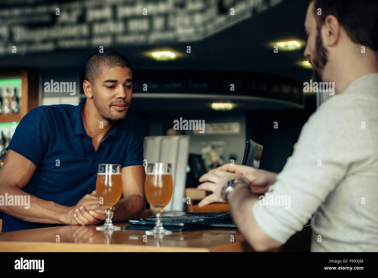 Business men sitting at bar hi-res stock photography and images - Alamy