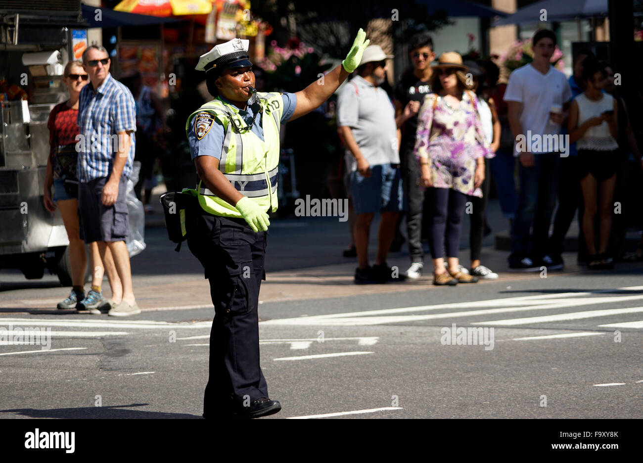 Police woman directing traffic near Herald Square in midtown Manhattan ...