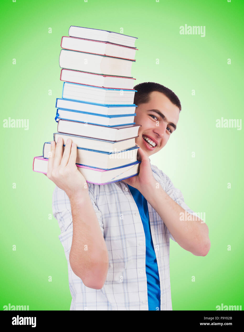 Student with lots of books on white Stock Photo - Alamy