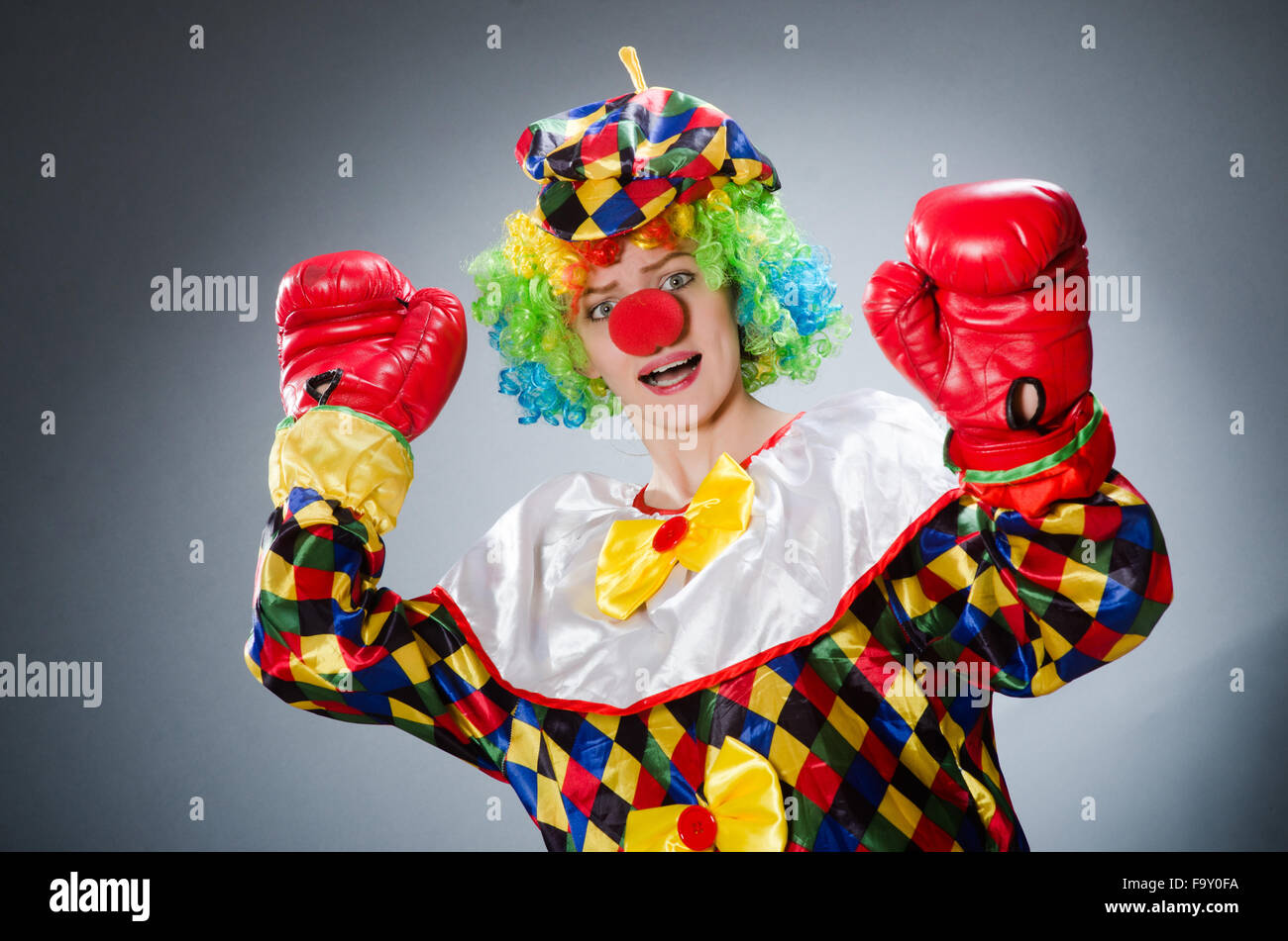 Clown with boxing gloves in funny concept Stock Photo - Alamy