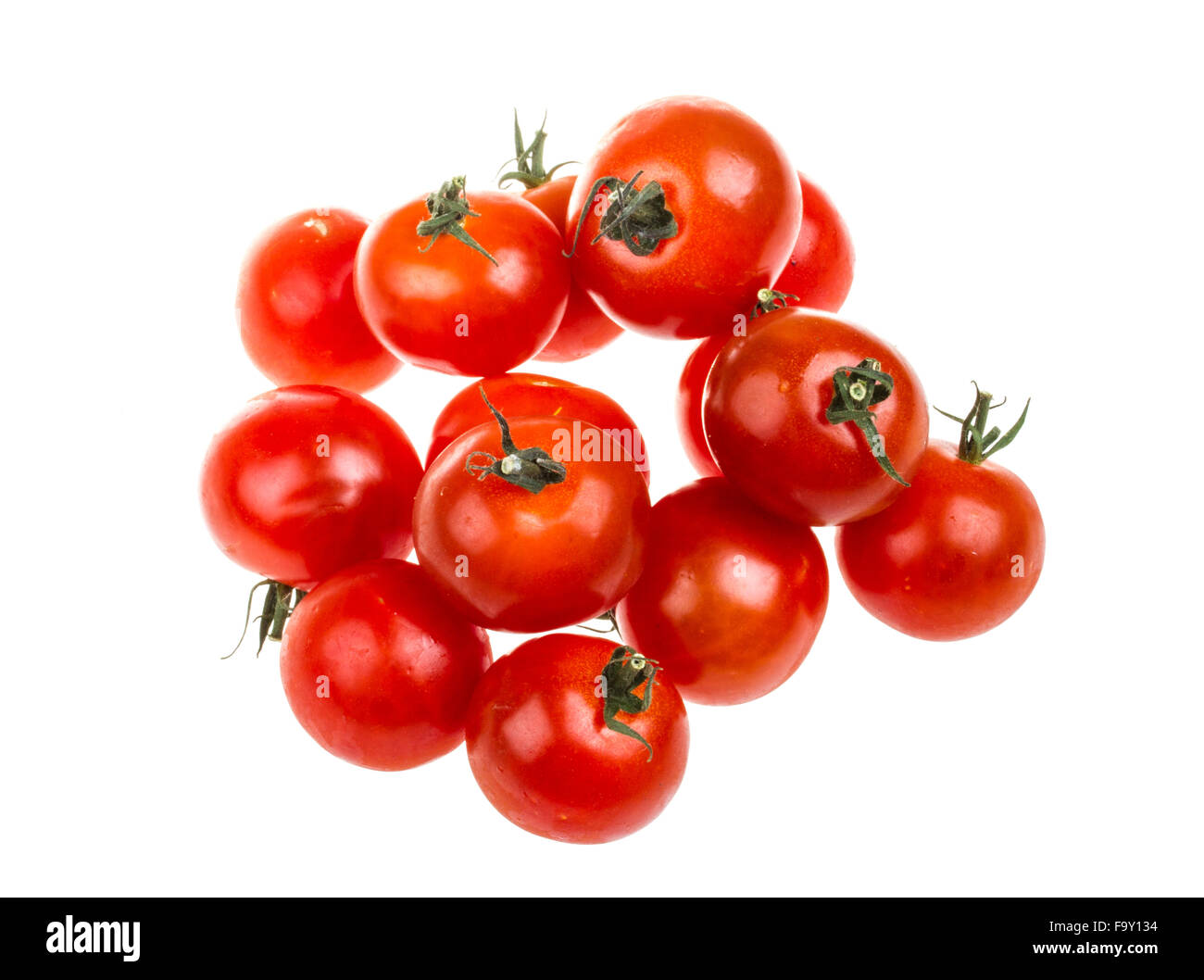 Small cherry tomato on white background close up Stock Photo - Alamy